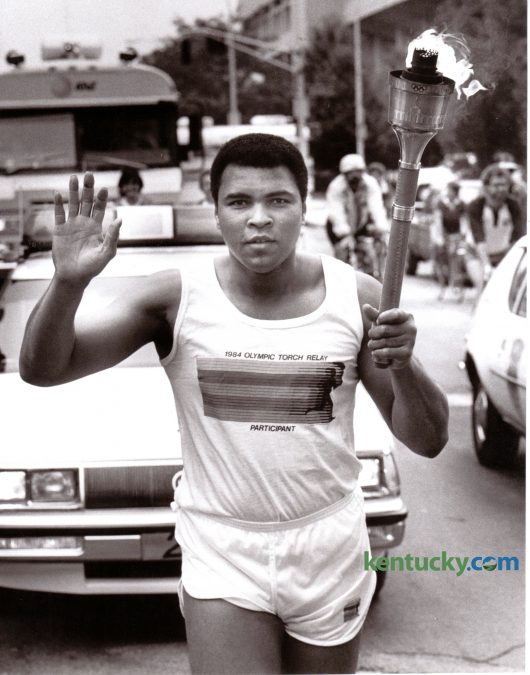 Muhammad Ali carries Olympic torch through Louisville, 1984 | Kentucky ...